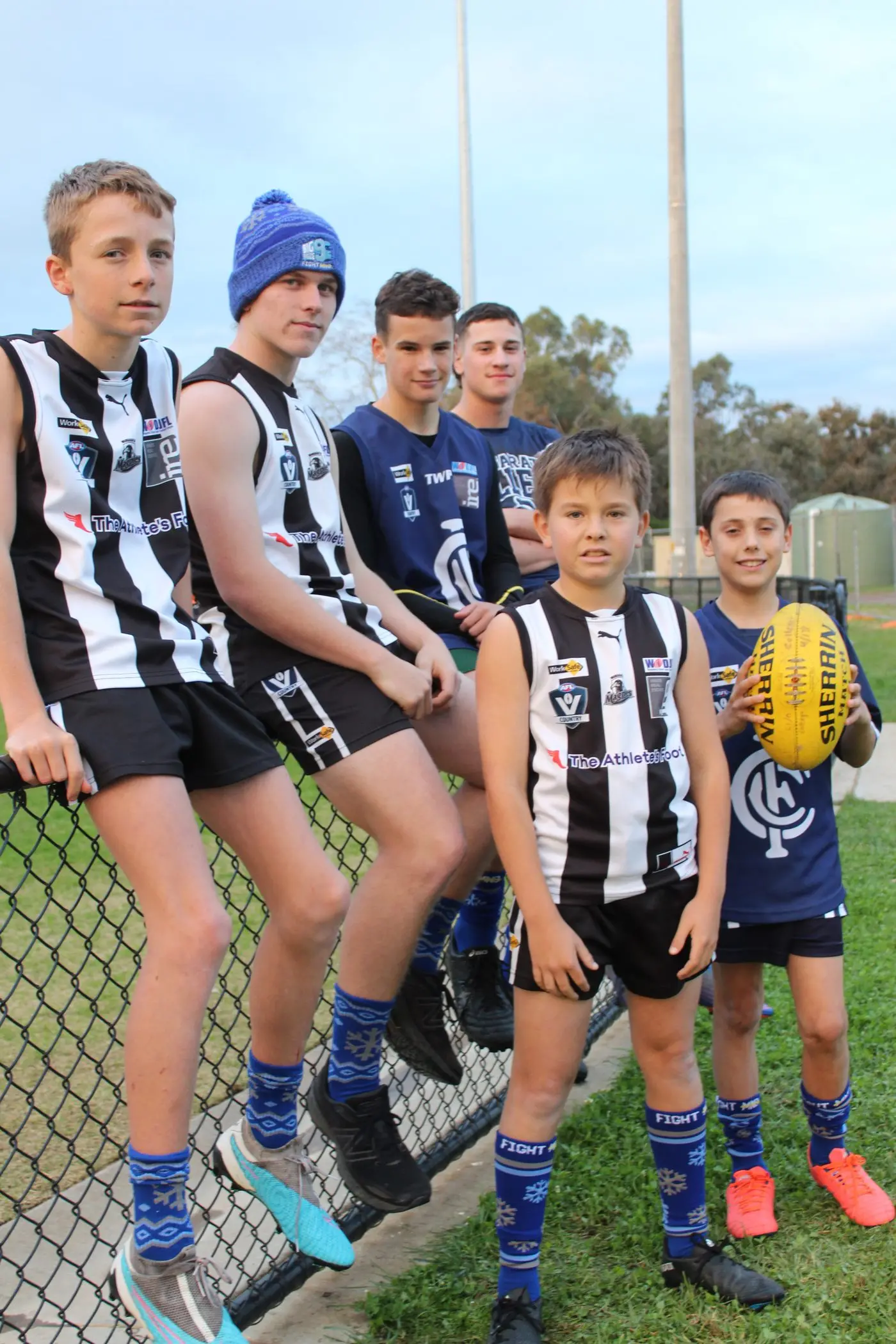 Young footy players do it for Daniher